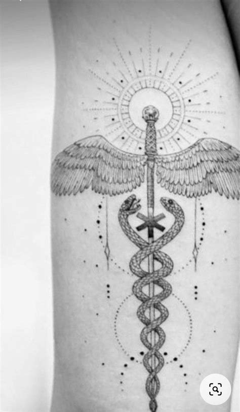 Cadus Tattoo On Thigh