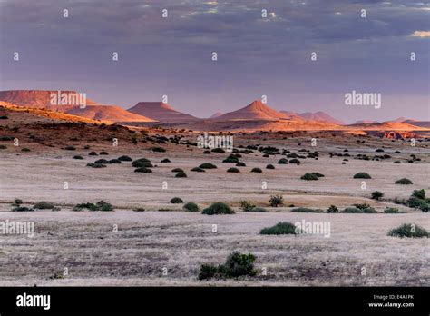 Africa Namibia Damaraland View To Grassland And Volcanos By Sunset