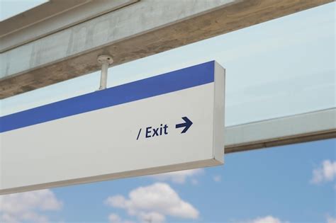 Premium Photo Clear Signage Indicating Exit Direction At Transportation Facility For Better