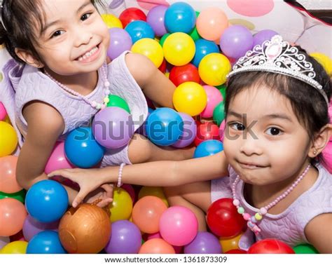 Female Asian Identical Twins Sitting On Stock Photo Shutterstock