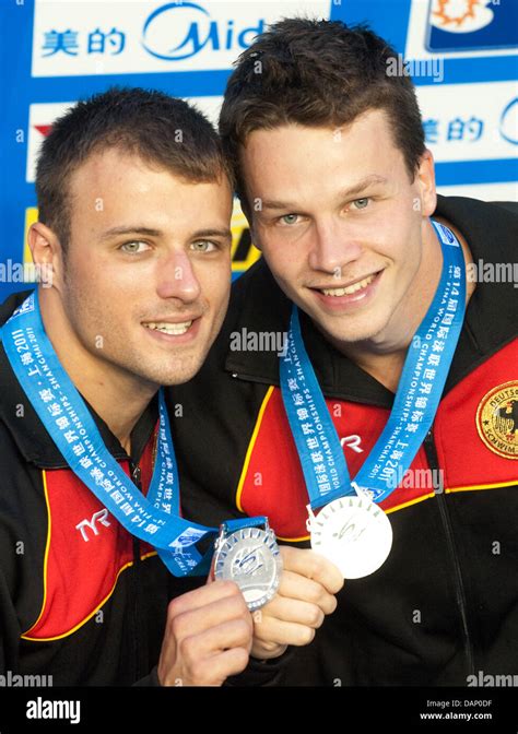 Germanys Sascha Klein L And Patrick Hausding Display Their Silver Medals After The Mens 10m