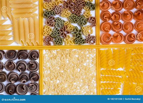 Raw Pasta Of Different Colors And Types Laid Out In Square Cells Stock Photo Image Of Macro