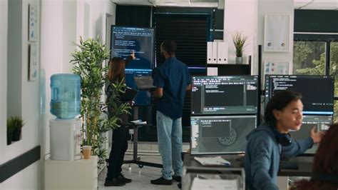 Premium Photo Diverse Team Of System Developers Analyzing Code On Big Tv Screen Checking