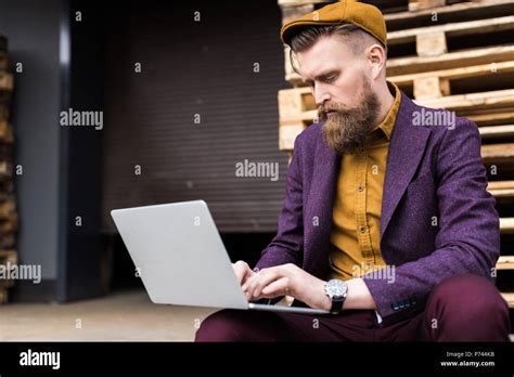 Stylish Bearded Businessman Typing On Laptop Keyboard Stock Photo Alamy