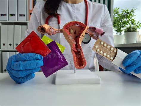 Female Doctor Holds Condom For Prevention Of Aids And Birth Control