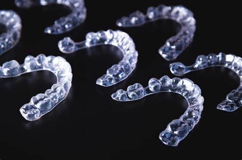 Premium Photo Lot Of Aligners Lie On A Black Background Studio Shot