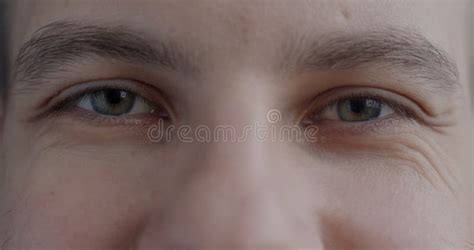 Close Up Slow Motion Portrait Of Young Man S Eyes Looking At Camera