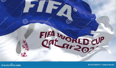 Flags With Fifa And Qatar 2022 World Cup Logo Waving In The Wind Stock