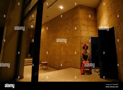 Cuban Model Grisel Escobar Sits Prior To The Art And Fashion Show At