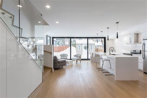 Black Extension Contrasts Pale Brick Quebec City Home
