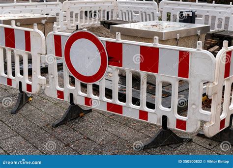 Construction Barriers Blocking Pathway In Urban Area During Day Stock
