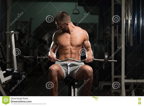 Geek Man With Barbell Exercising Biceps Stock Image Image Of Male