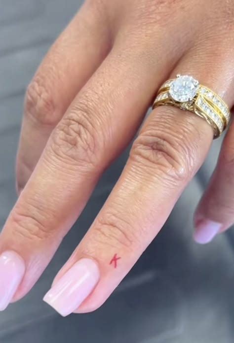 Ring Finger Initial Tattoo