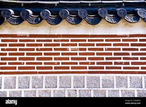 A Brick Wall With A Red Brick Border The Wall Is Made Of Bricks And