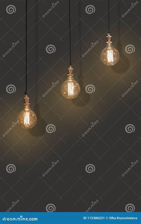 Three Classic Edison Lights Bulb Isolated On Black Background With