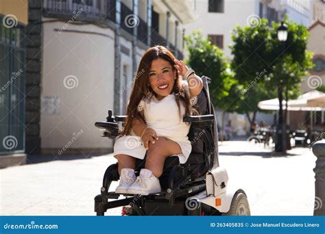 Beautiful Young Disabled Woman In Wheelchair And Reduced Mobility