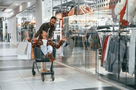 Premium Photo Active People Having Fun Riding In The Cart Young