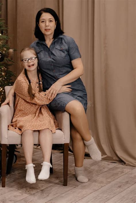Mom And Daughter The Girl Is Sick With Down Syndrome Stock Image