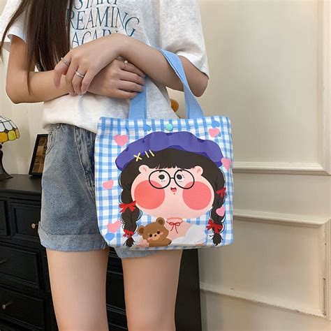 直销卡通手提袋可爱简约帆布包女新款饭盒包外出通勤手拎布袋