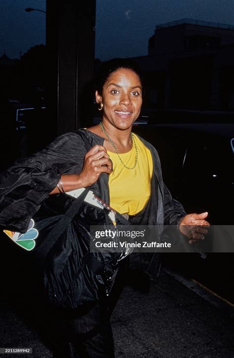 American Actress Phylicia Rashad Wearing A Black Jacket Over A News