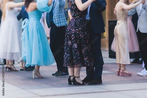 High School Graduates Dancing Waltz And Classical Ball Dance In Dresses