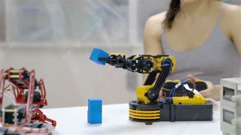 Woman Controlling Robot Stock Video Clip K0078117 Science Photo