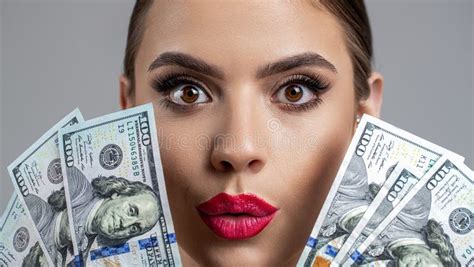 Girl Holding Cash Money In Dollar Banknotes Surprise Young Woman Holding Up Cash Money Of One