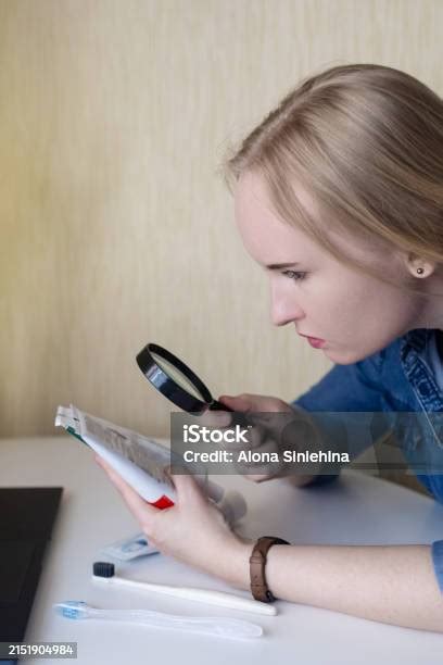 Toothpaste Ingredients Girl At Laptop Checks Composition Of Toothpaste