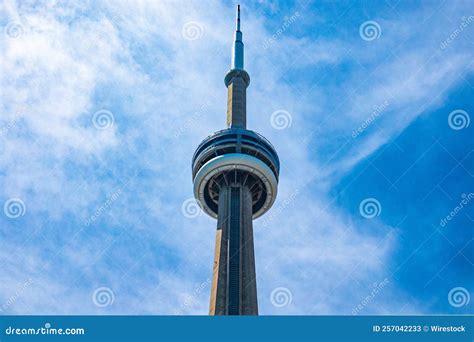 Partial Shot Of The Cn Tower Under Blue Cloudy Sky Editorial Stock