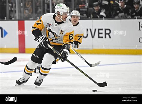 Pittsburgh Penguins Center Sidney Crosby Controls The Puck During The