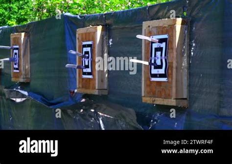 Throwing Knives At The Target From An Open Air Distance A Competition
