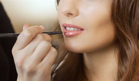 Makeup Artist Apply Makeup Beautiful Young Girl Lipstick With A