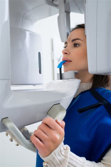 Panoramic Teeth X Ray Being Administered To Young Woman At Dental