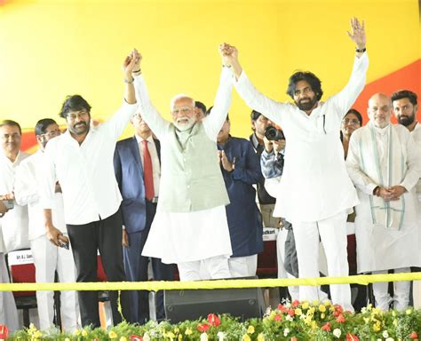 Mass Pic Chiru Holds Pawan In Front Of Modi