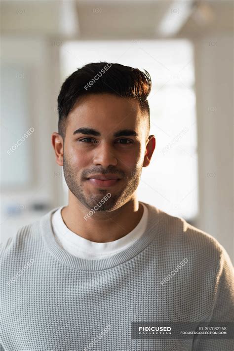 Portrait Of A Young Mixed Race Man Looking To Camera — Design Designer