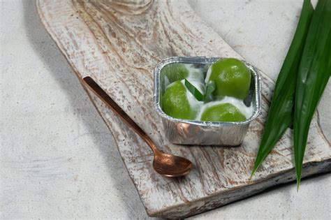 Premium Photo Kue Putri Mandi Or Badak Berendam Are Steamed Glutinous Rice Balls Filled With