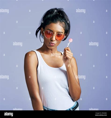 Lollipop Pout Studio Portrait Of A Beautiful Young Woman Sucking On A