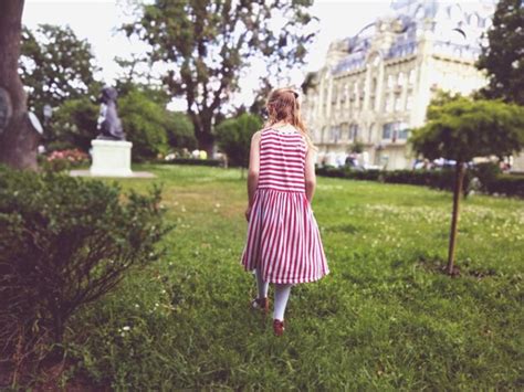Premium Photo Rear View Of Girl Walking On Grass