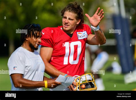 Los Angeles Chargers Quarterback Justin Herbert 10 Is Escorted By