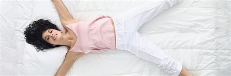Premium Photo Young Woman Lying With Arms And Legs Wide Apart On