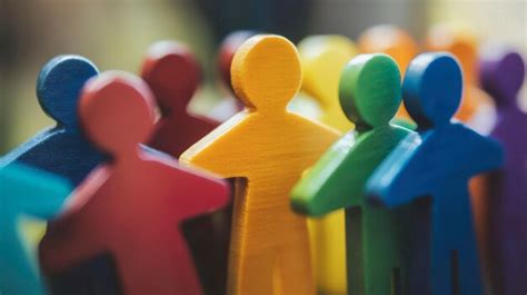Colorful Wooden Figures Symbolize Unity And Community Diversity Premium Ai Generated Image