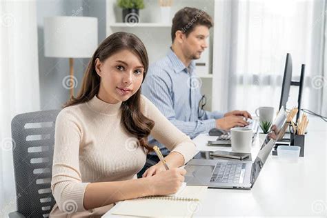 Woman Taking Crucial Note On Paperwork For Looking At Camera Postulate Stock Image Image Of