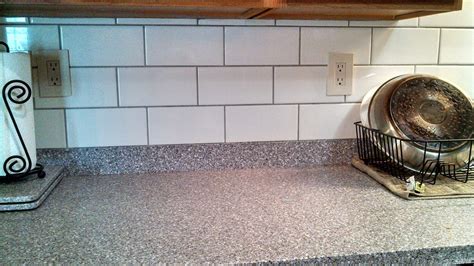 Subway Tile Backsplash And Solid Surface Countertops