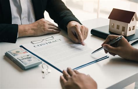 Premium Photo Midsection Of Agent Assisting Buyer In Singing Contract