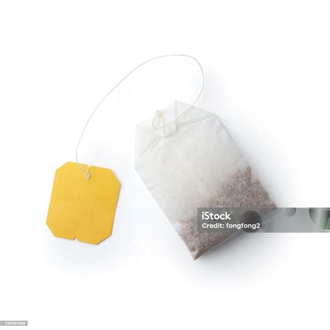 Top View Of Teabag With Yellow Label Isolated On White Background Stock