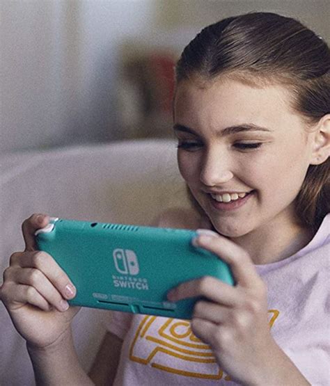 Nintendo Switch Lite Turquoise In 2025 Playing Switch Pose Nintendo Switch System Nintendo