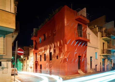 Gg Loop Transforms Italian House With Red Faceted Facade