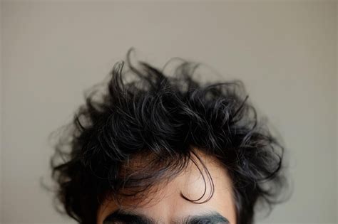 Closeup Detail Of A Messy Bedhead Hairstyle Of A Man With Unruly Black