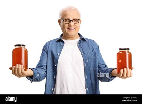 Smiling Mature Man Holding A Jar Of Honey In Each Hand Isolated On