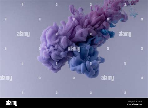 Colorful Ink Swirling In Water Cloud Of Silky Ink On White Background